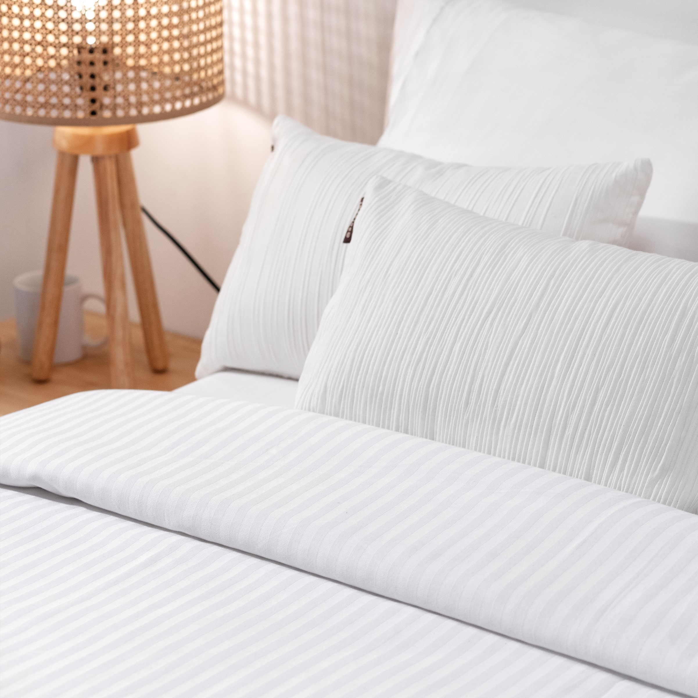 Colcha jacquard de algodón con dibujo en forma de forma de rayas